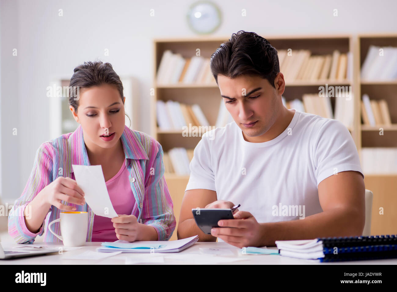 Young family discussing family finances Stock Photo - Alamy
