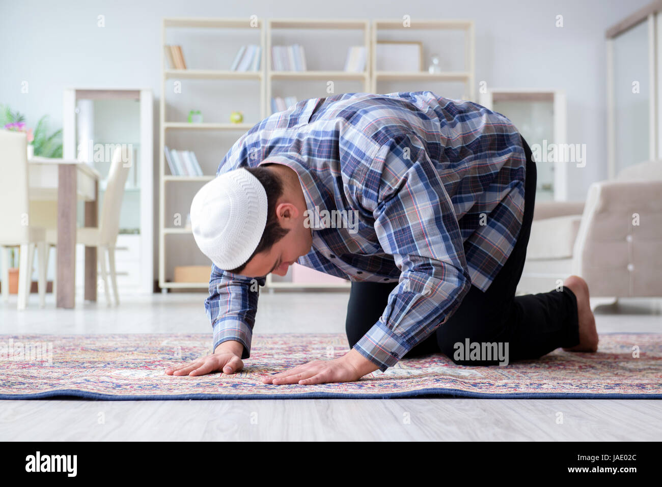 Muslim man praying at home Stock Photo - Alamy