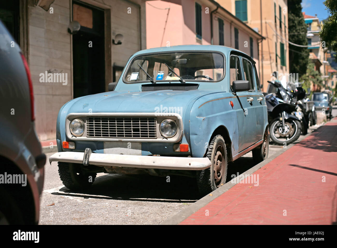 Old damaged blue car on the street Stock Photo - Alamy