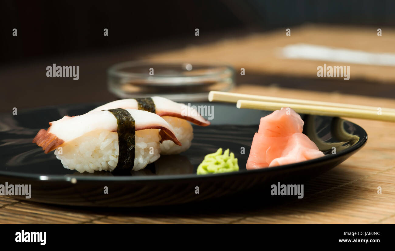 Sushi in sushi bar. Table and ration sushi Stock Photo - Alamy