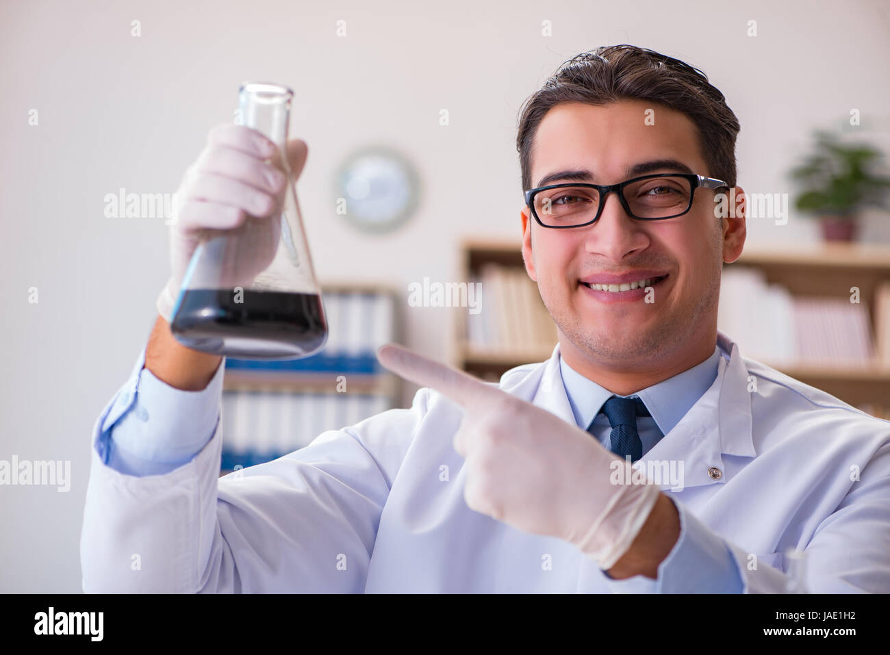 Young lab assistan working in the laboratory Stock Photo - Alamy