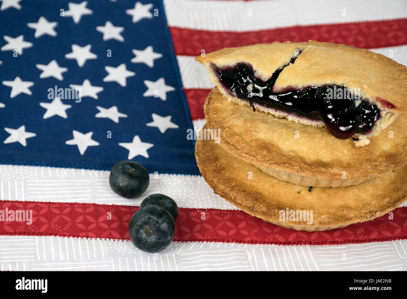 mini blueberry pie stack on American flag place mat Stock Photo - Alamy
