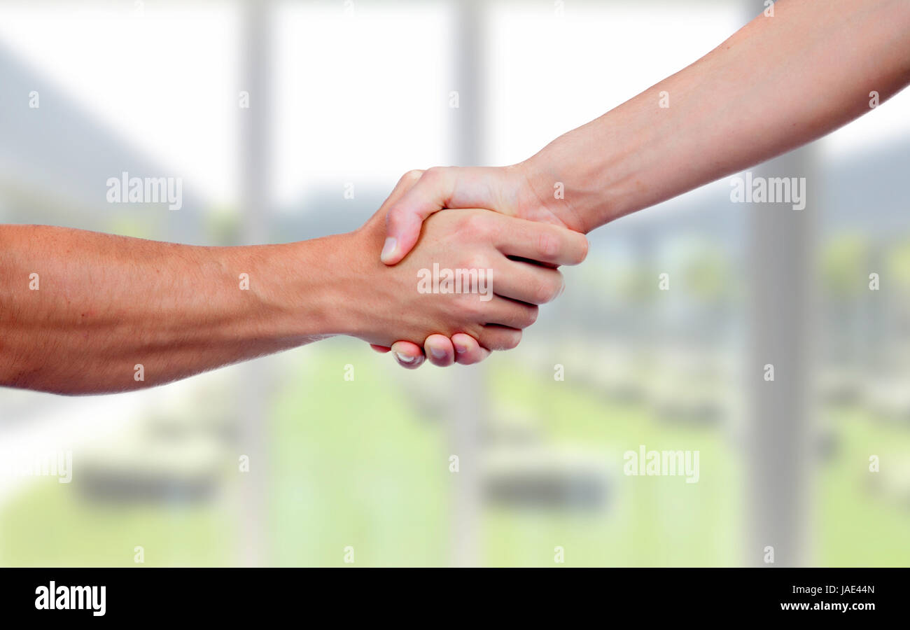 People closing a deal with a handshake Stock Photo - Alamy