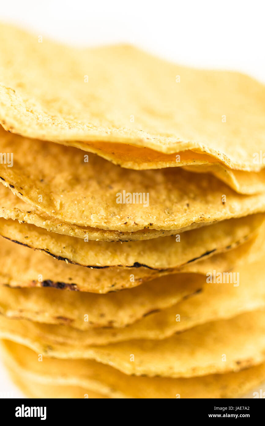 Homemade tostada shells on a white background Stock Photo - Alamy