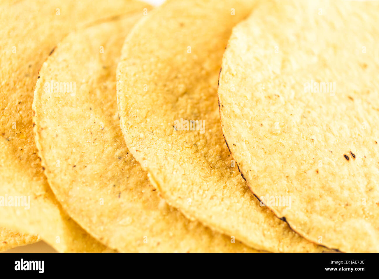 Homemade tostada shells on a white background Stock Photo - Alamy