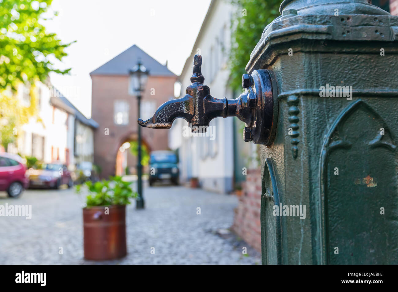 street view with a water tap of a historical drinking fountain in ...