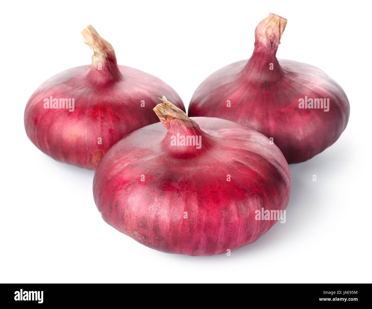 Three red onions isolated on white background Stock Photo - Alamy