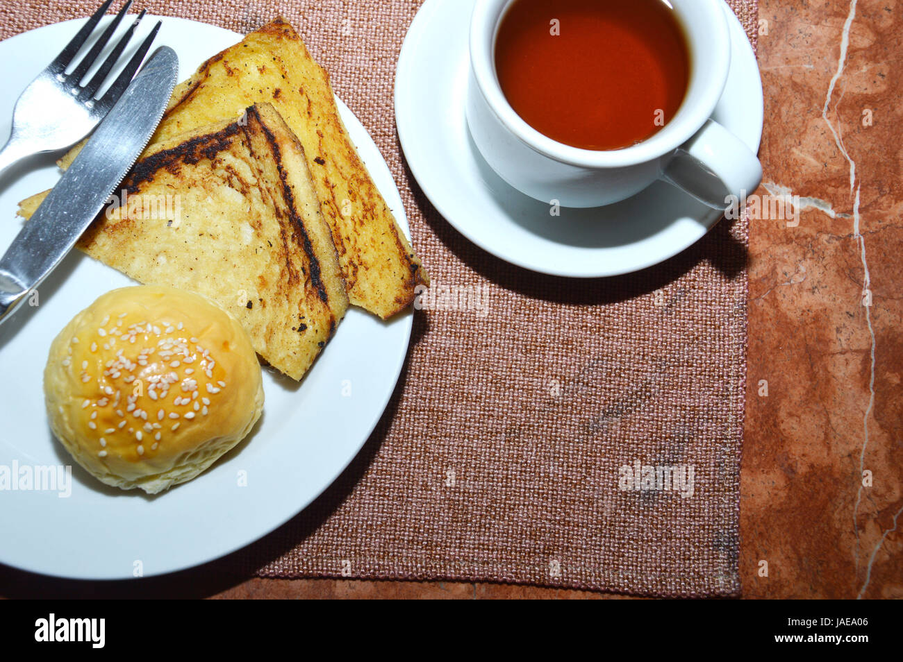 toast on white plate and a cup of tea Stock Photo - Alamy