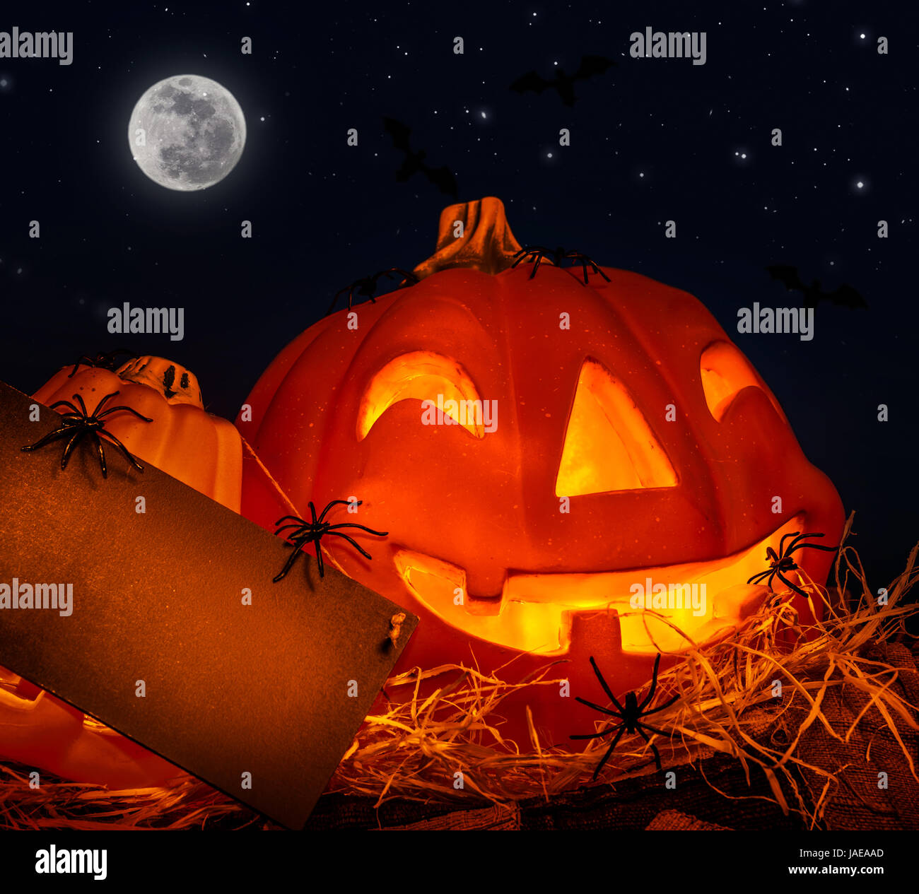Scary carved glowing gourd on dark starry sky background, moon light ...