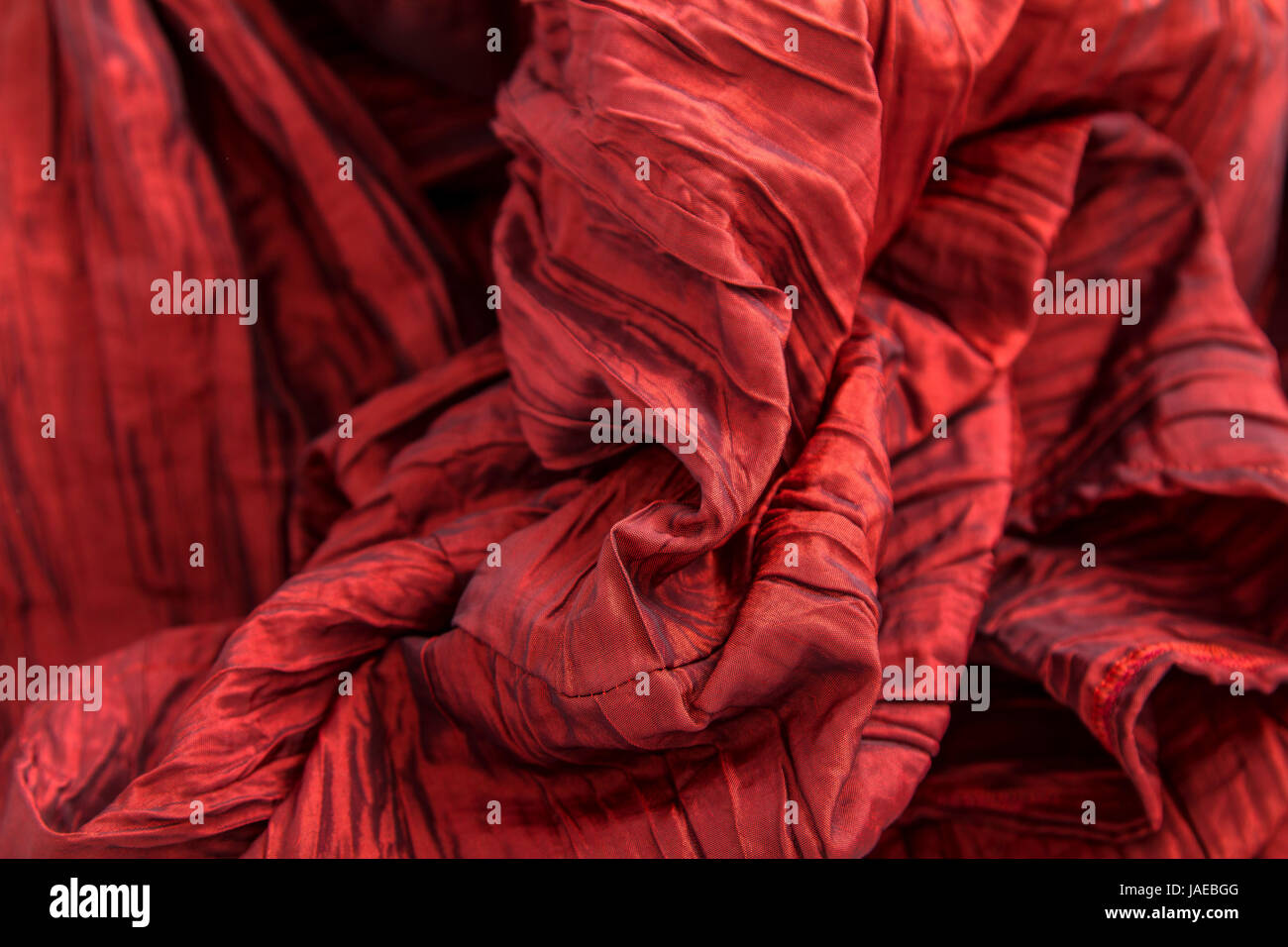 A fancy wrinkled red fabric background Stock Photo - Alamy