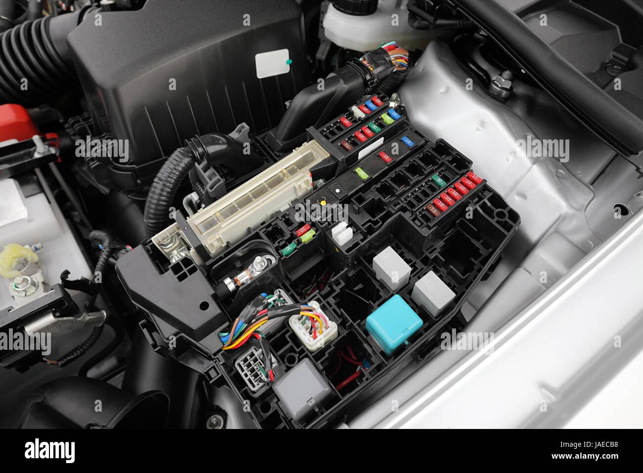 Detail of a car engine bay with fuses Stock Photo - Alamy