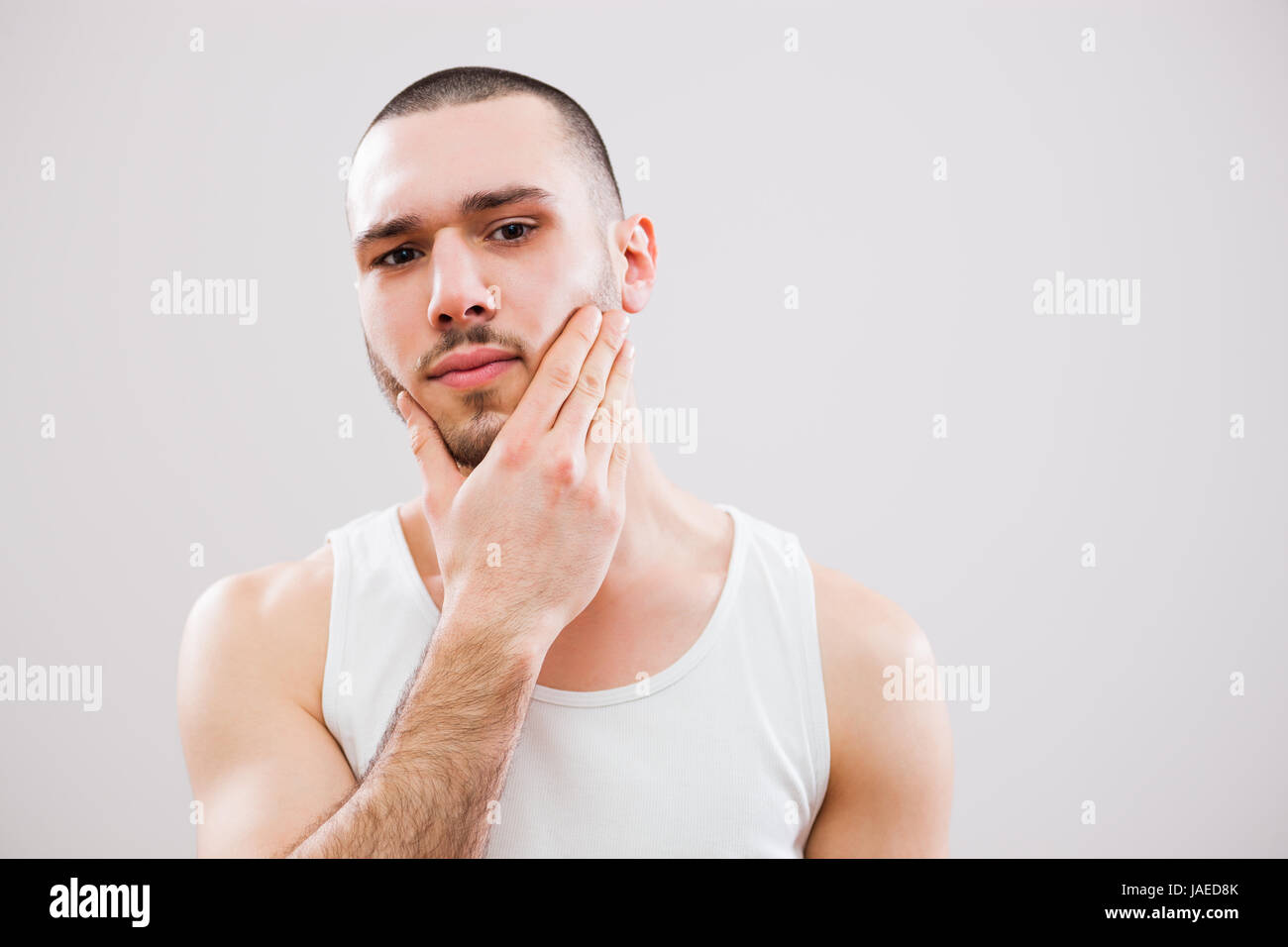 Young man is going to shave his beard Stock Photo - Alamy