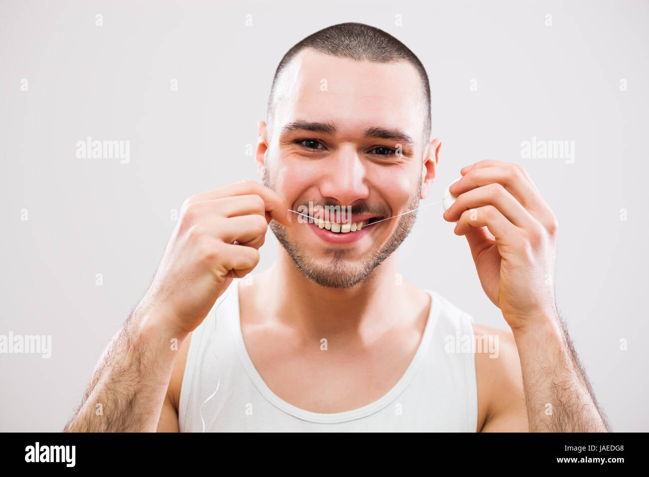 Man dental floss cleaning teeth hi-res stock photography and images - Alamy