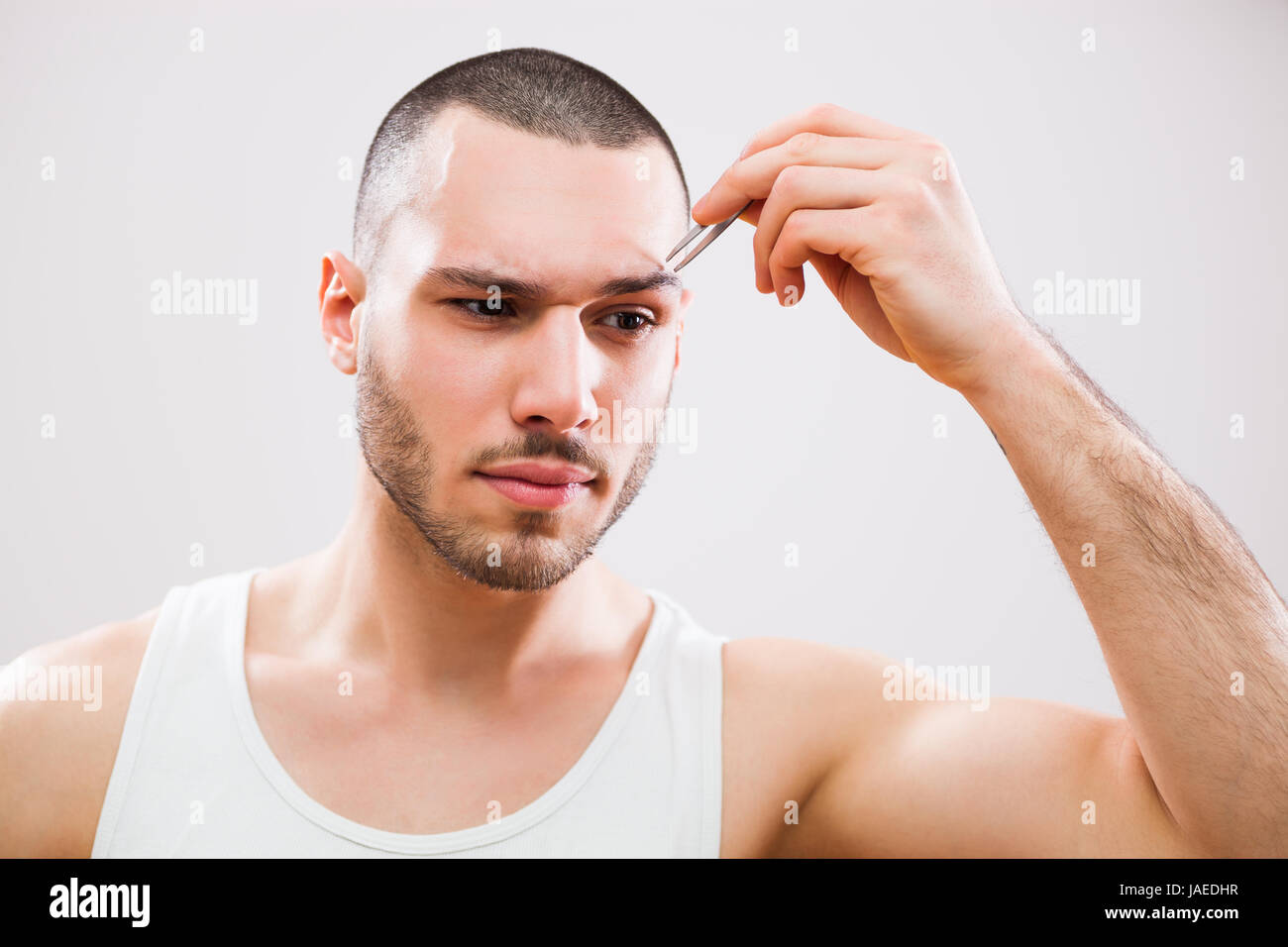 Man and plucking eyebrows hi-res stock photography and images - Alamy