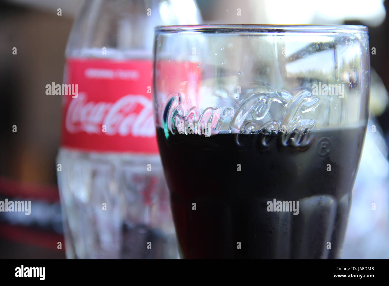 Coca Cola bottle and glass Stock Photo - Alamy