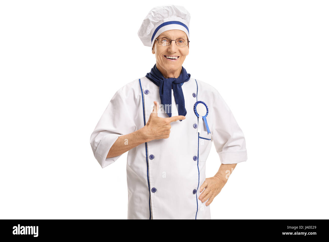 Happy chef with an award ribbon pointing isolated on white background ...