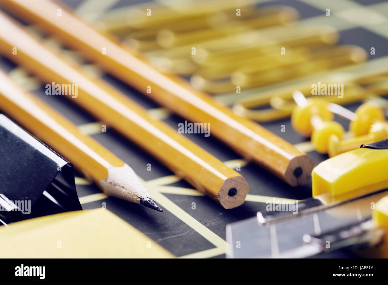Yellow school accessories on the foreground Stock Photo - Alamy