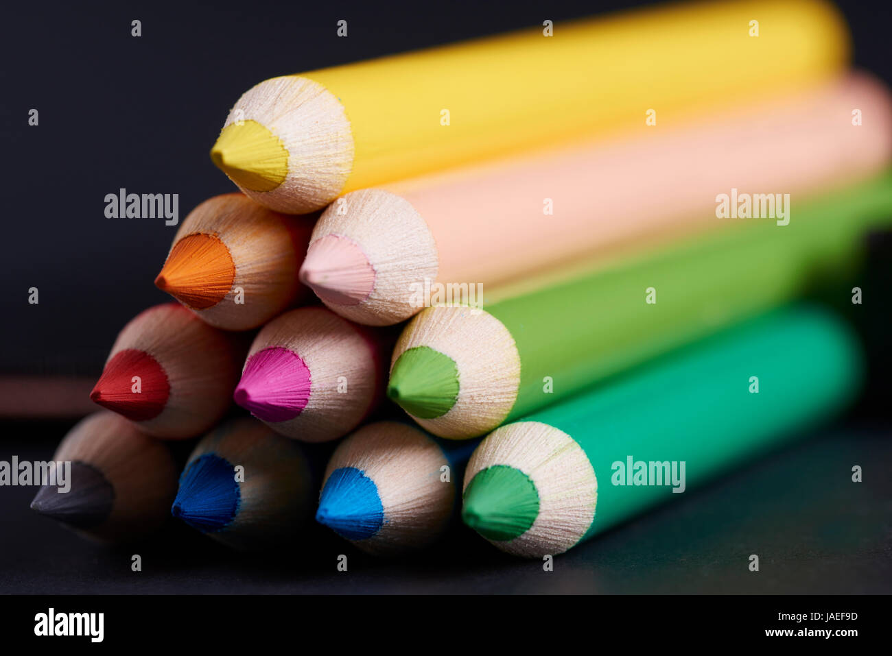 Pyramid shape of colored pencils Stock Photo - Alamy