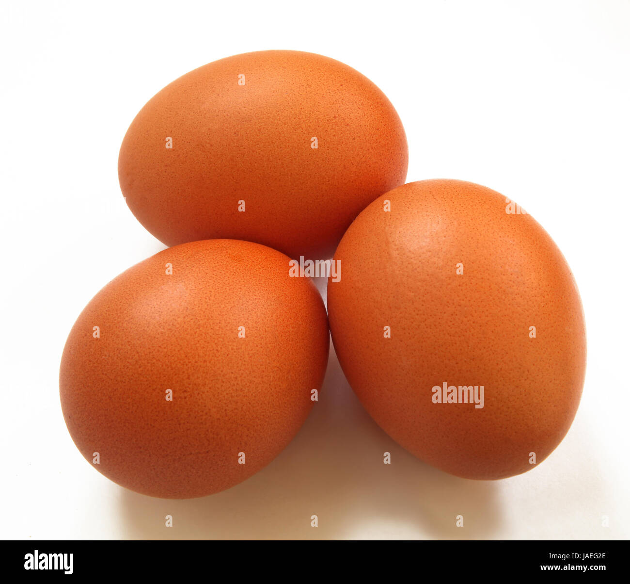 three eggs isolated in white Stock Photo - Alamy