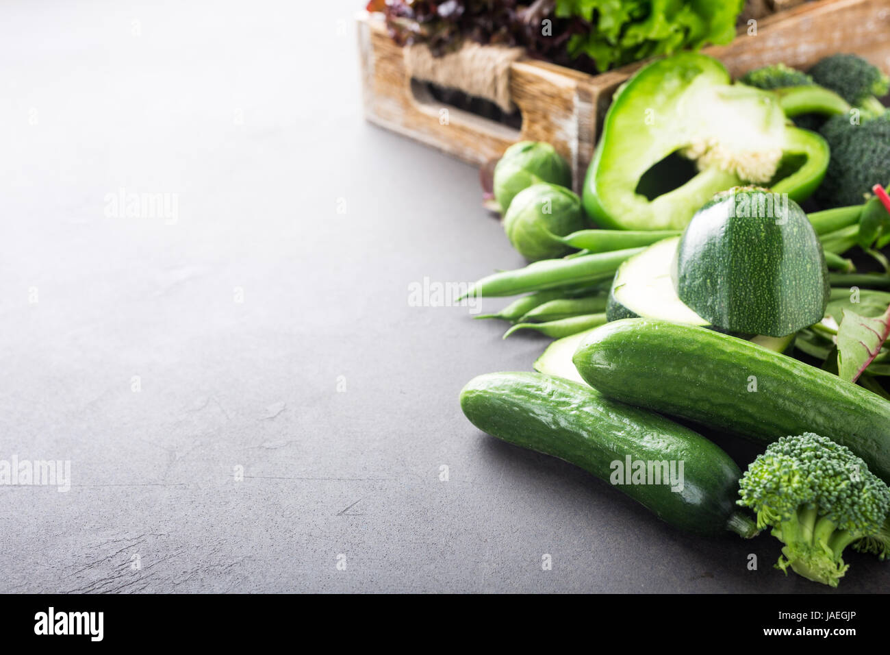 Mini cucumbers with assorted green vegetables, salad, broccoli, peas ...