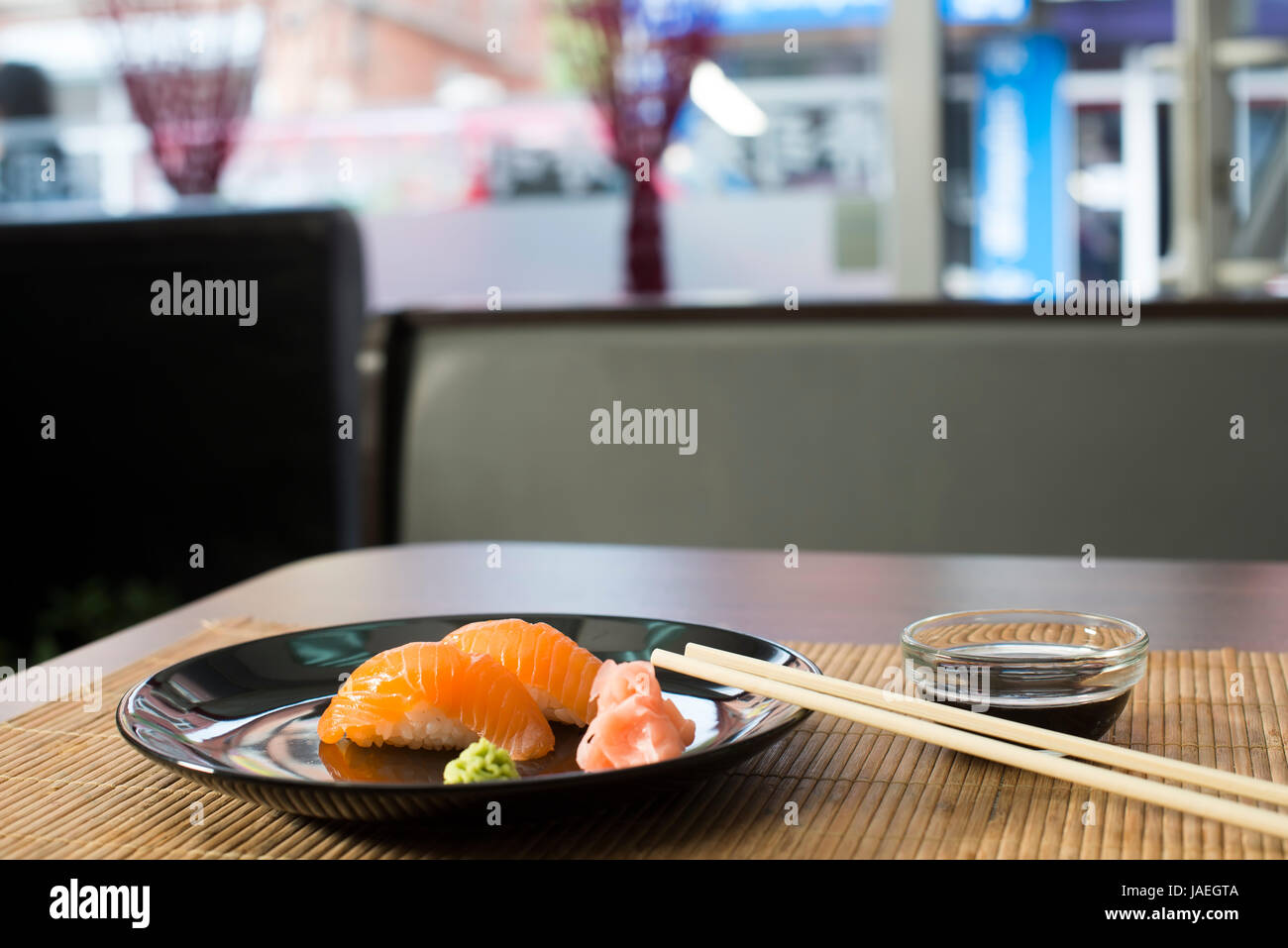 Sushi in sushi bar. Table and ration sushi Stock Photo - Alamy