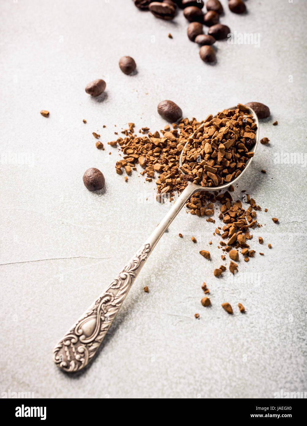 Spoon with instant coffee and coffee beans, retro style toned, copy ...