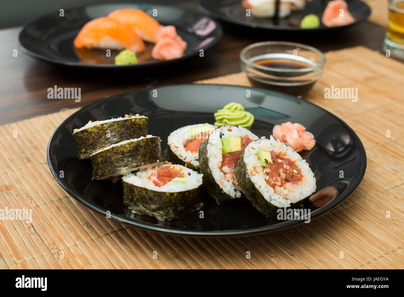 Sushi in sushi bar. Table and ration sushi Stock Photo - Alamy