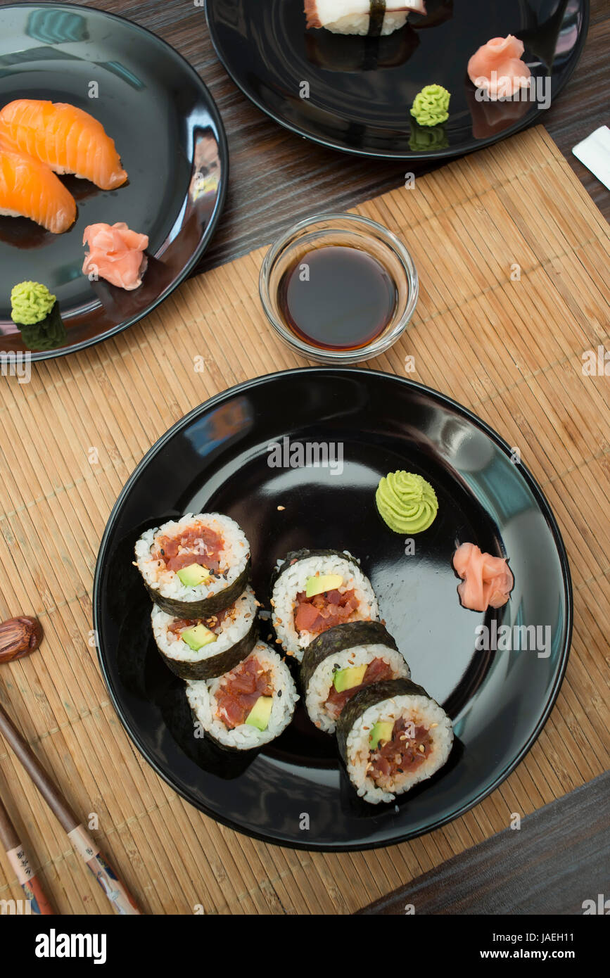 Sushi in sushi bar. Table and ration sushi Stock Photo - Alamy