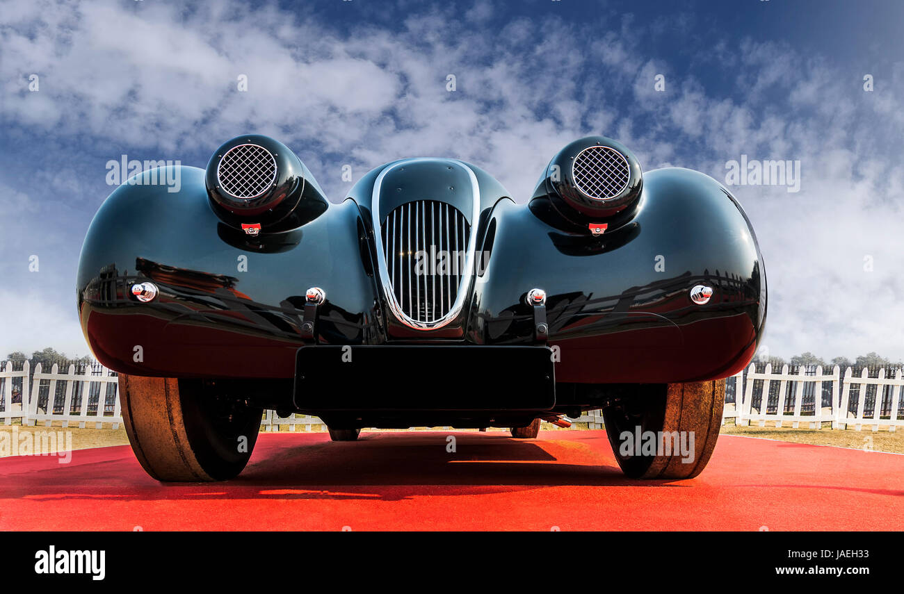 Front low angle view of an unknown old-timer retro vintage sports car ...