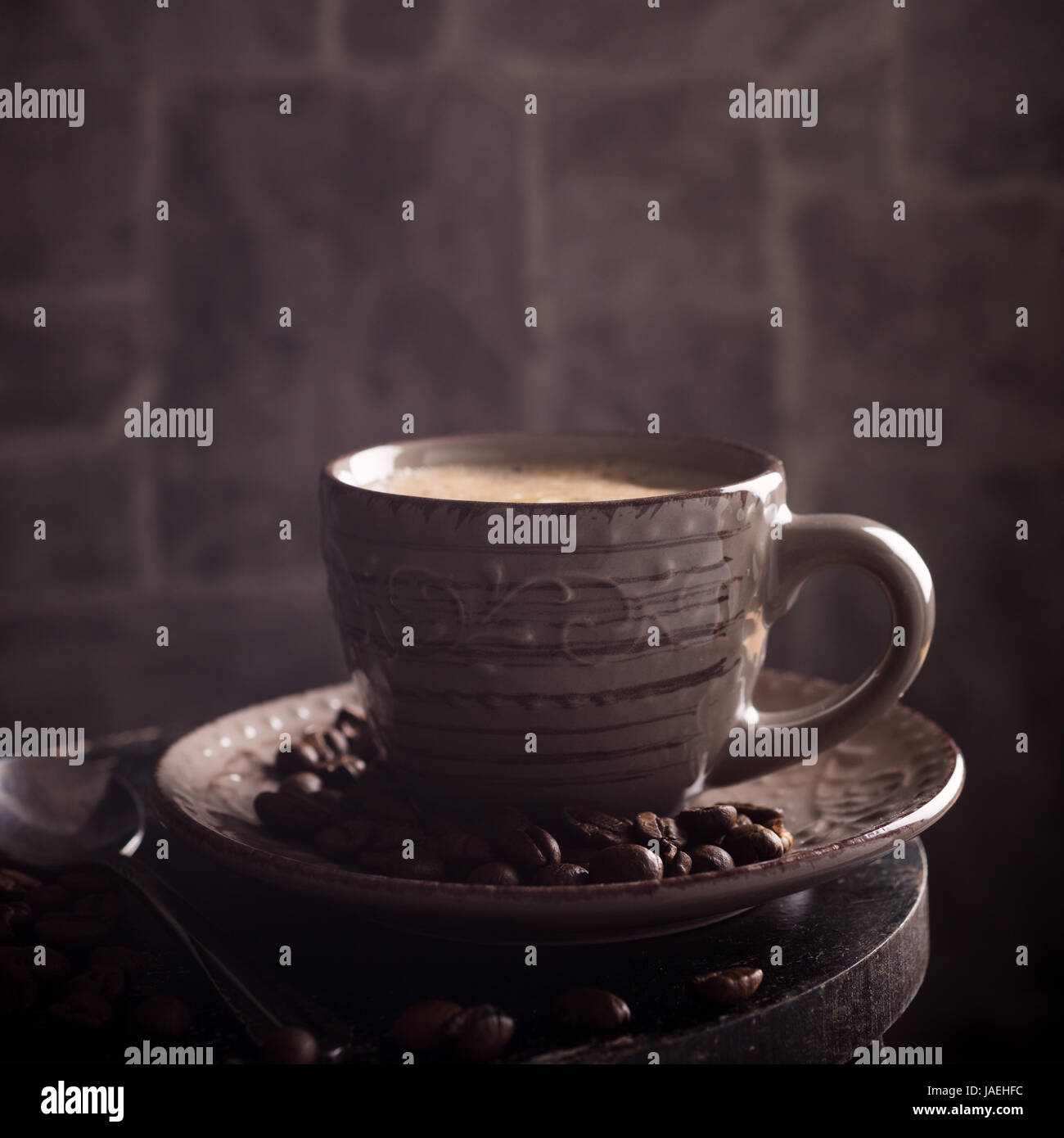Coffee cup with coffee beans on dark rustic background with space for ...