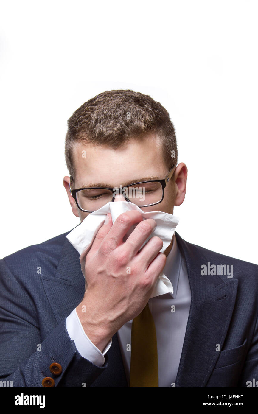 Young business man using a tissue Stock Photo - Alamy