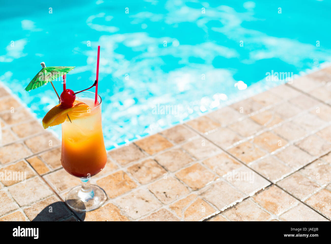 The orange cocktail near the swimming pool Stock Photo - Alamy