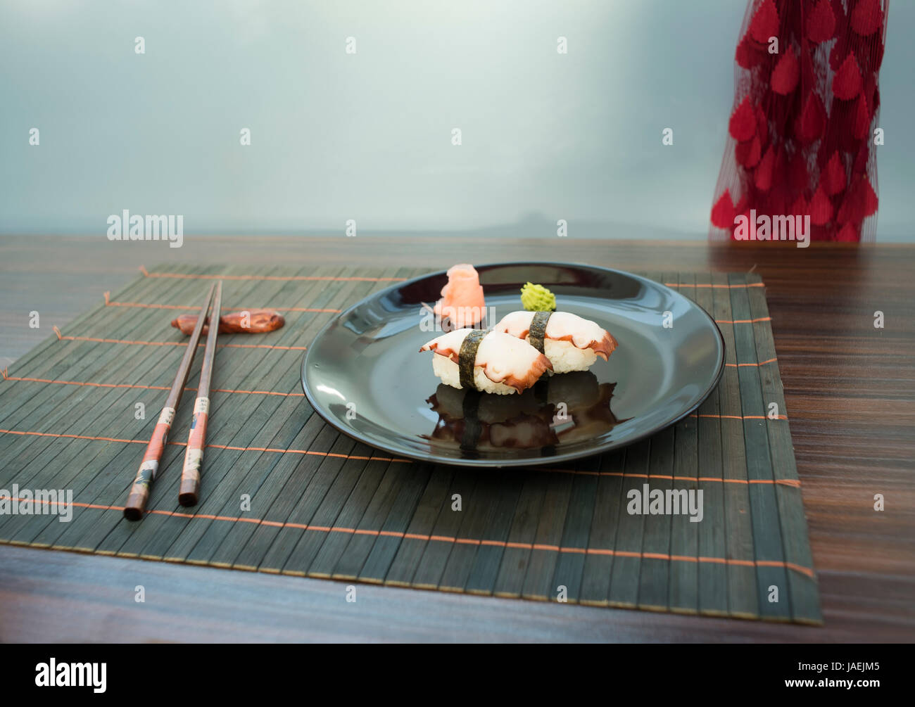Sushi in sushi bar. Table and ration sushi Stock Photo - Alamy