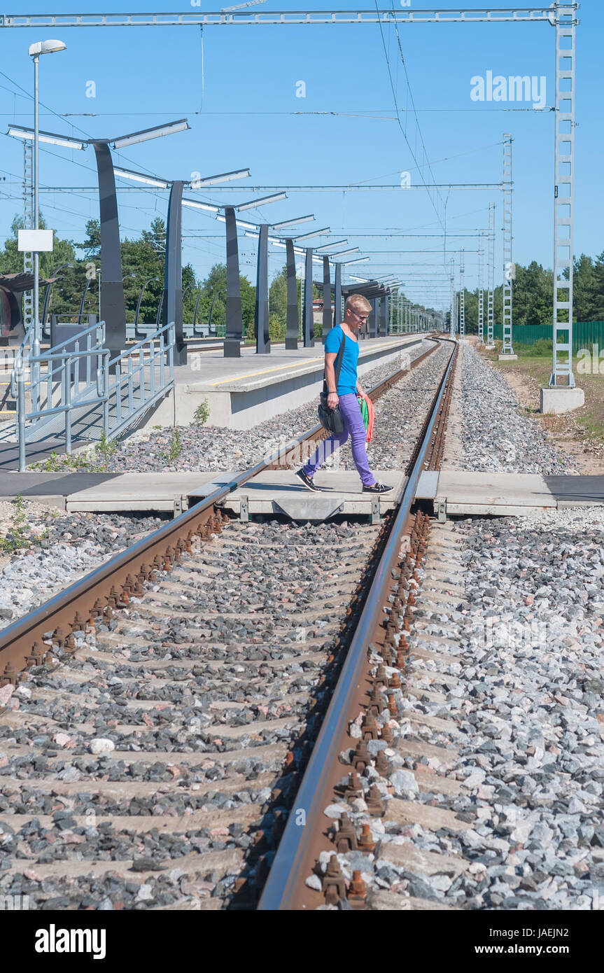 Person walking across tracks hi-res stock photography and images - Alamy