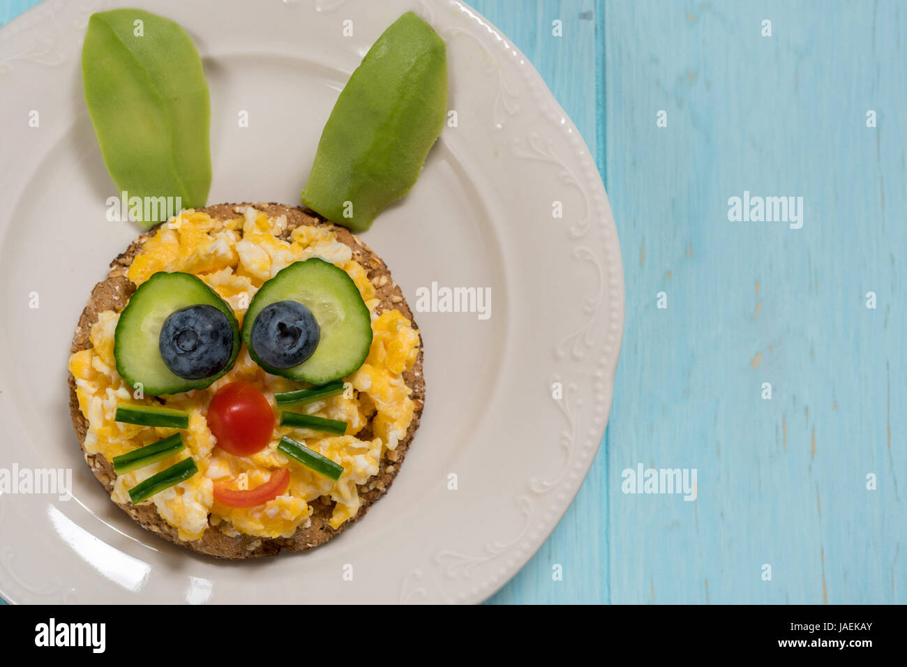 Scrambled eggs funny bunny for kid breakfast Stock Photo - Alamy