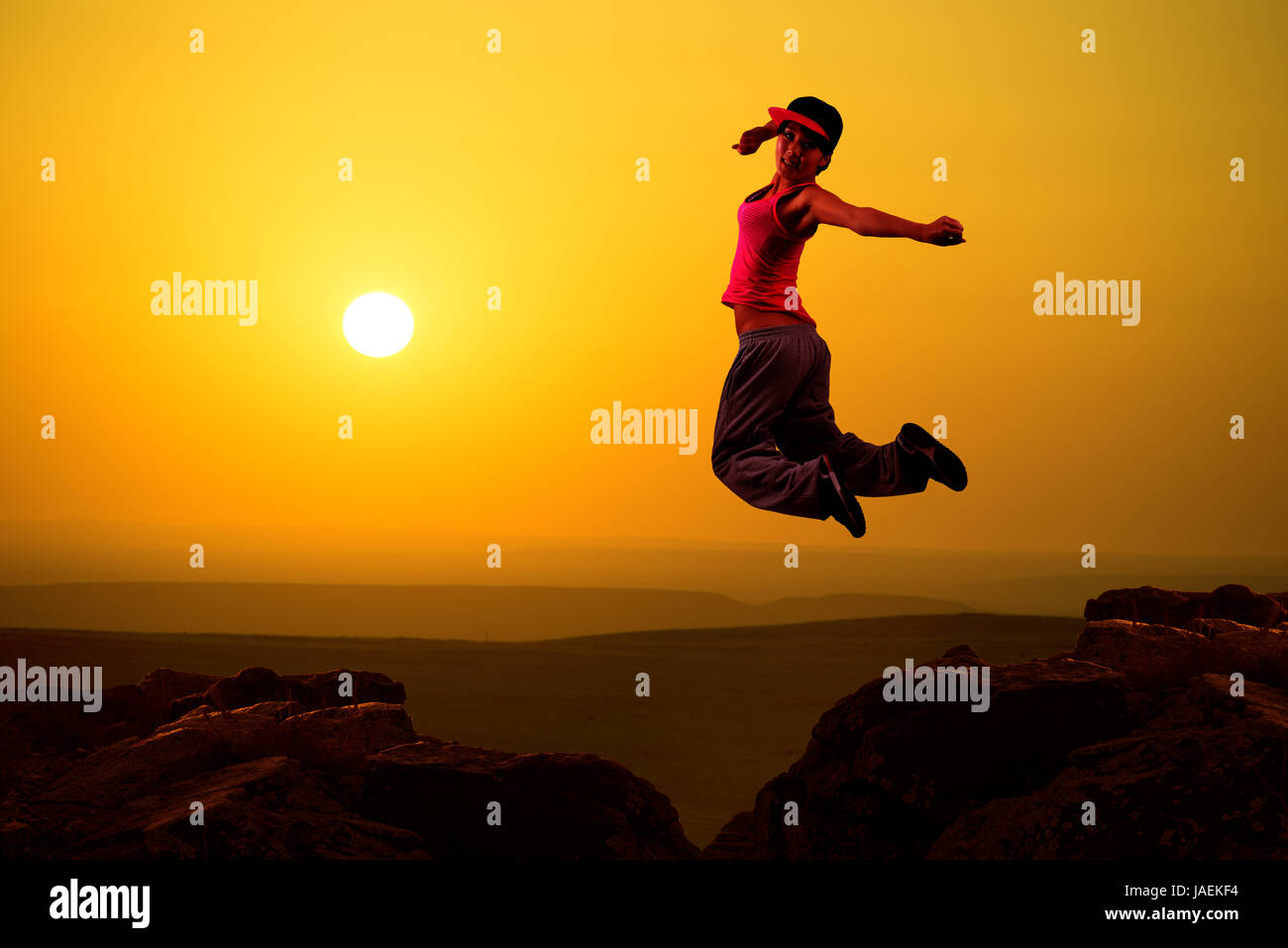The beauty of a woman dancing in the sunrise.Mountain landscape Stock ...