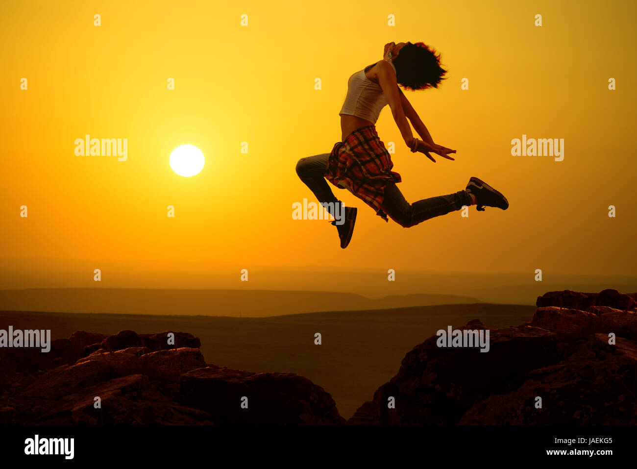 The beauty of a woman dancing in the sunrise.Mountain landscape Stock ...
