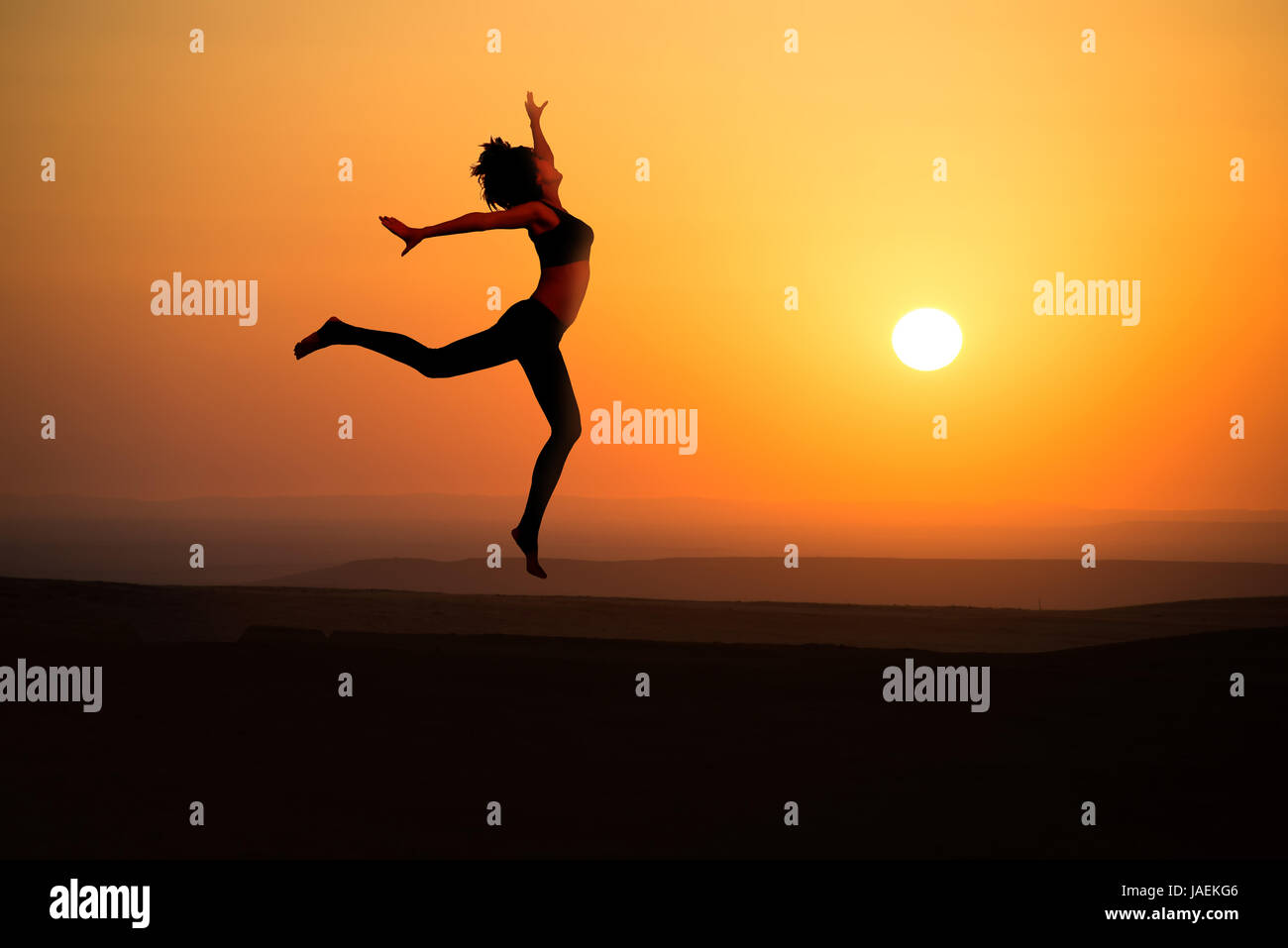 The beauty of a woman dancing in the sunrise.Mountain landscape Stock ...