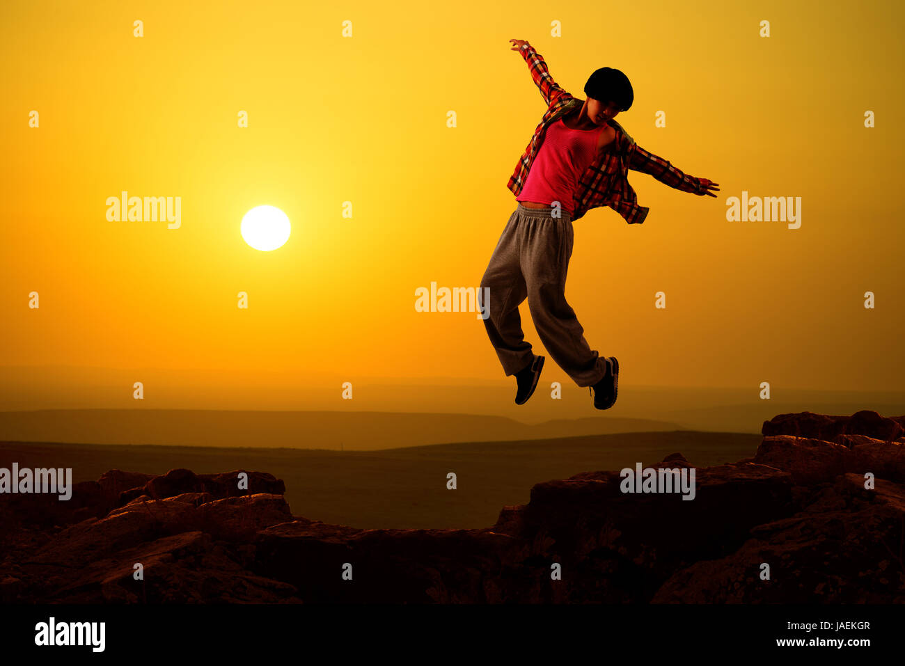 The beauty of a woman dancing in the sunrise.Mountain landscape Stock ...