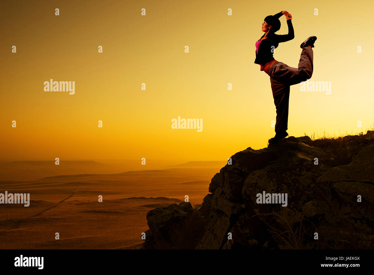 The beauty of a woman dancing in the sunrise.Mountain landscape Stock ...