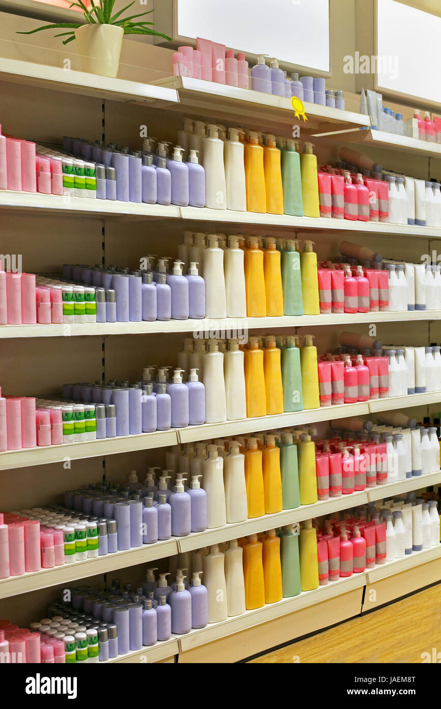 Large shelf inside retail cosmetic store with colorful bottles Stock ...