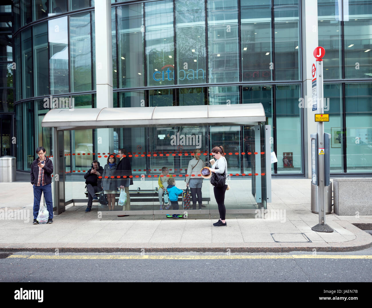 London, United Kingdom, 7 may 2017: several people wait at bus stop in ...