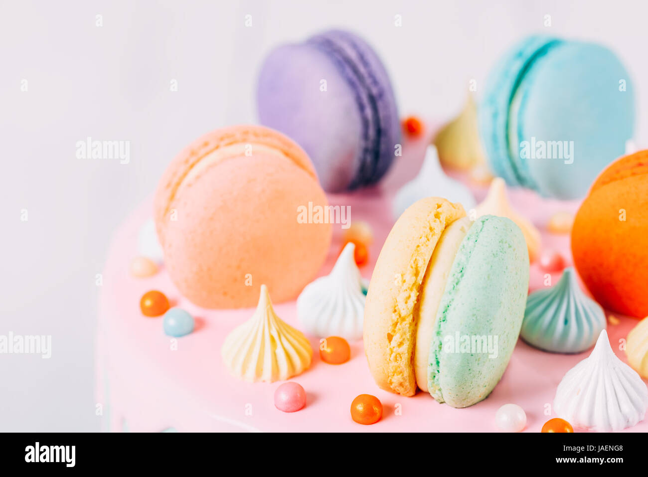Colorful Macaron Birthday Cake And Sweet Candy Topping Stock Photo - Alamy