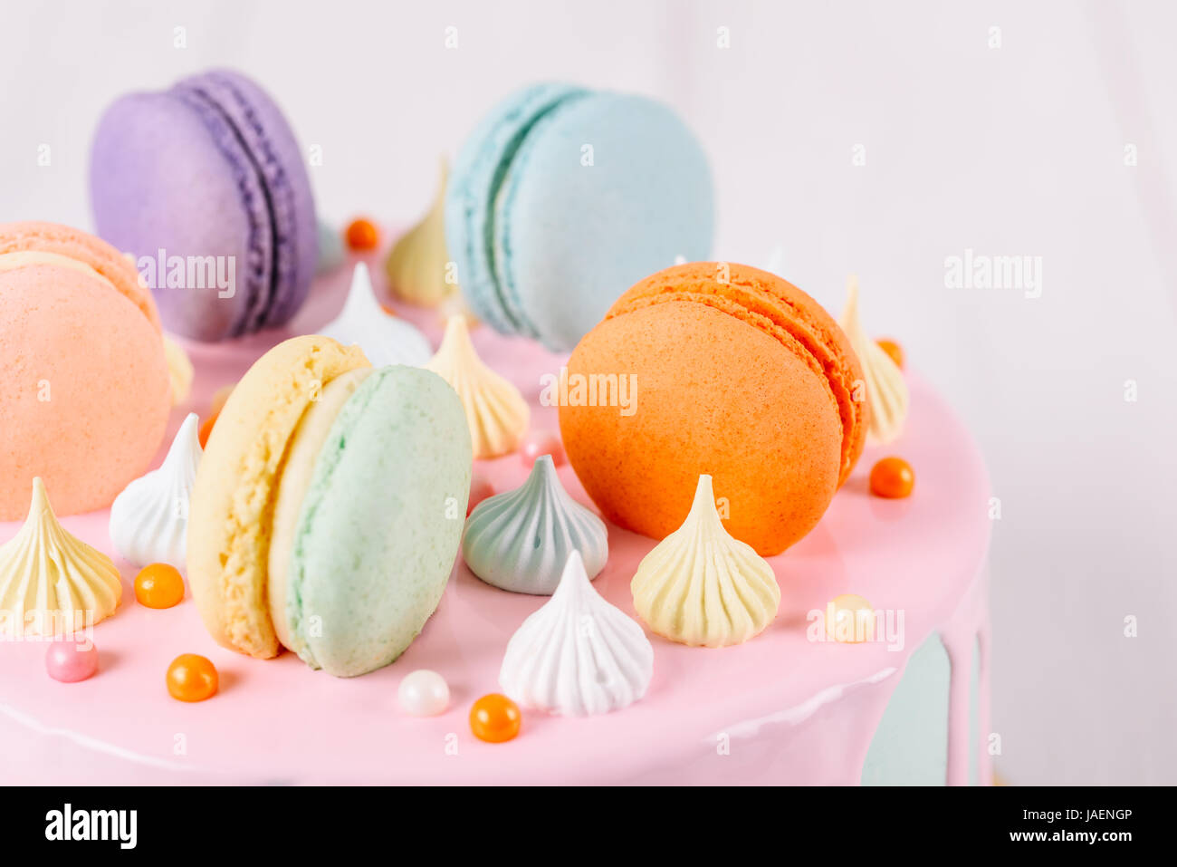 Colorful Macaron Birthday Cake And Sweet Candy Topping Stock Photo - Alamy