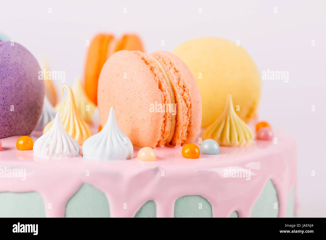 Colorful Macaron Birthday Cake And Sweet Candy Topping Stock Photo - Alamy
