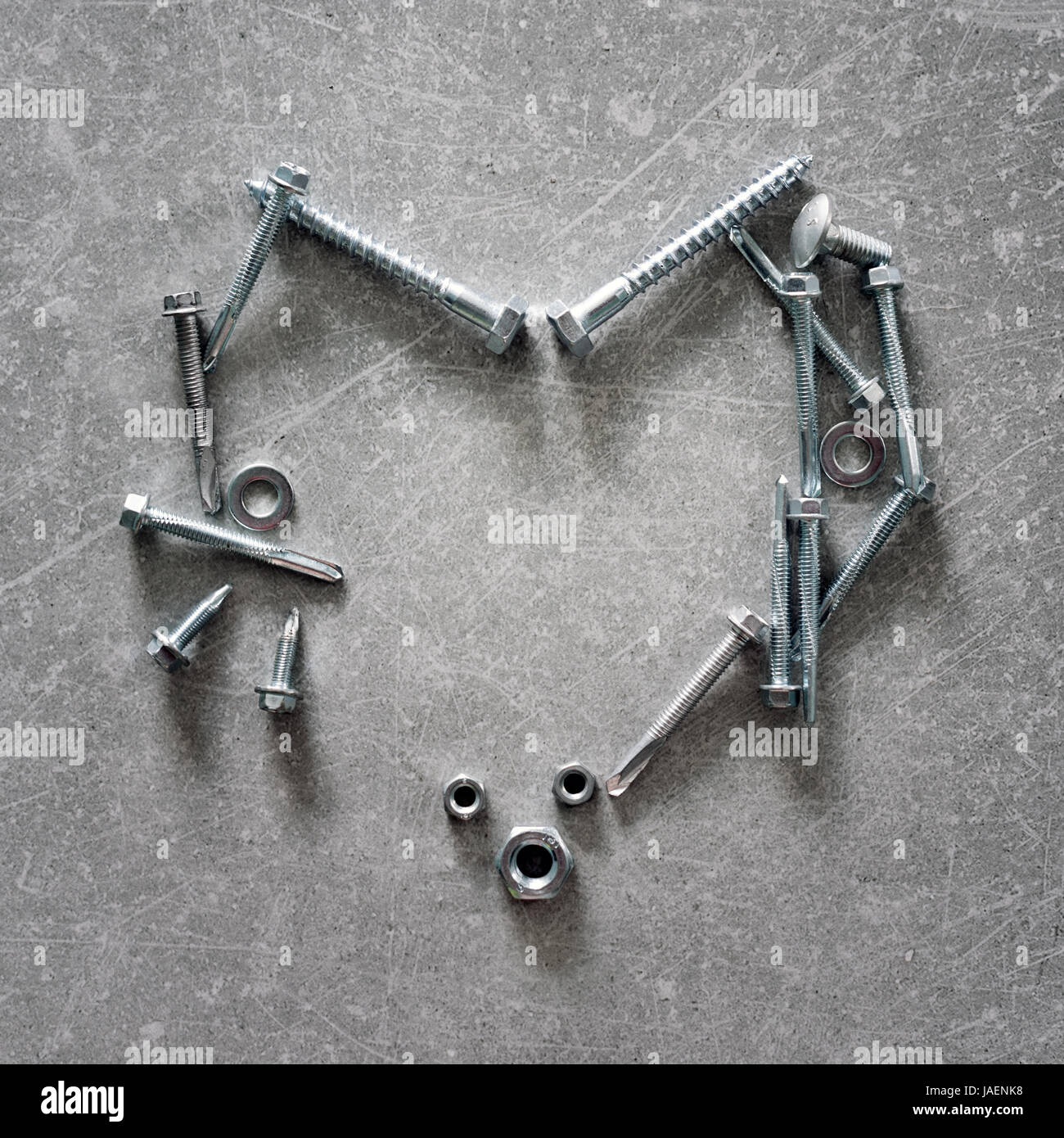 Heart symbol made of screws, nuts and bolts. Heart-shaped construction ...
