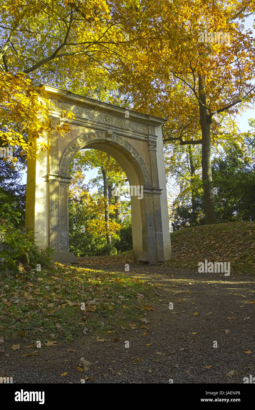 Autumn park with unknown romantic gate. Tree leaves are yellow Stock ...