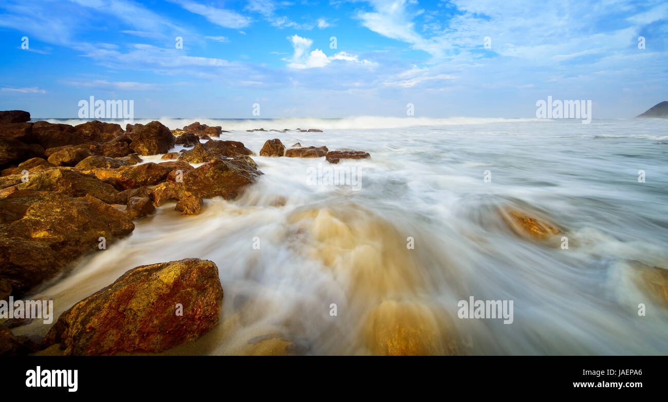 The beautiful silky smooth water waves and rocks at Yarada Beach ...
