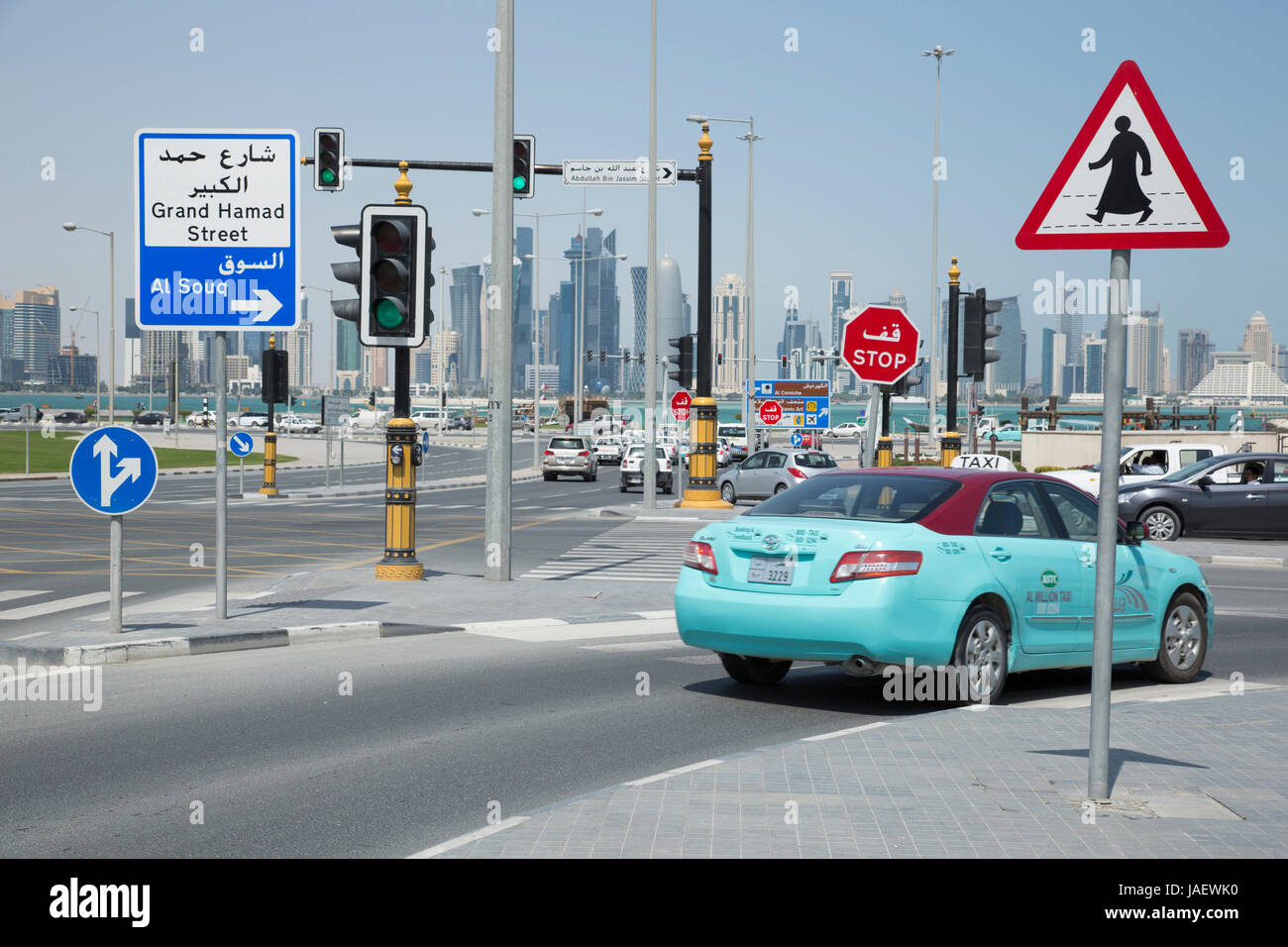 A turquoise taxi at a road junction of Al Asmakh Street and Abdullah ...