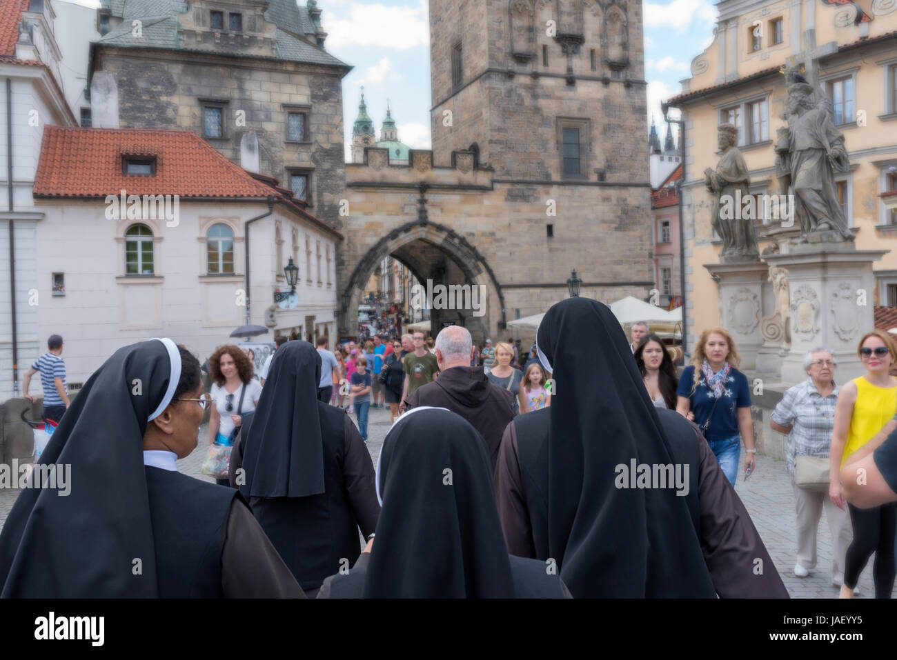 Priest and Nuns crossing the Charles Bridge, Prague, Czech Republic ...